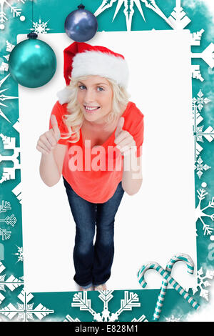 Blonde teenager woman wearing red sweater covering ears with fingers ...