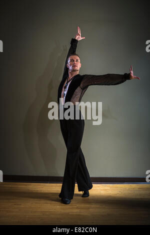 Man in suit with arms stretched out to sky Stock Photo - Alamy
