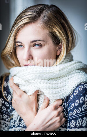 Young brunette woman having a cold close up isolated on white ...