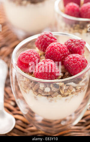 A cup of yoghurt with raspberries Stock Photo - Alamy
