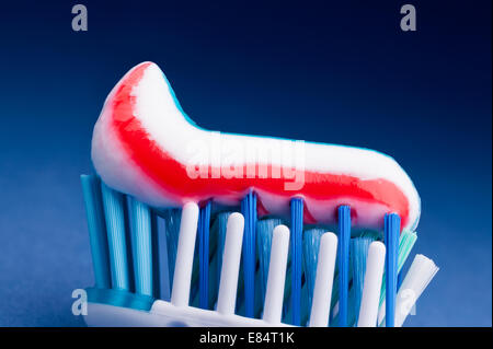 Toothpaste. Red and white striped toothpaste squeezed from the tube ...