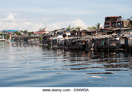 Slum along a canal in ghetto Tondo in Manila-Philippines Stock Photo ...