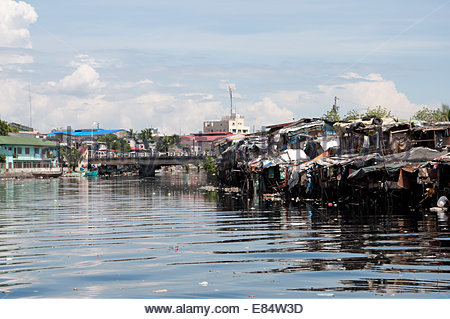 Slum along a canal in ghetto Tondo in Manila-Philippines Stock Photo ...