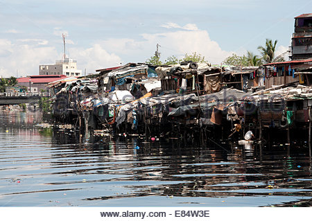Slum along a canal in ghetto Tondo in Manila-Philippines Stock Photo ...