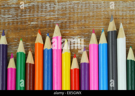 Colorful pencils on rustic wooden background Stock Photo - Alamy