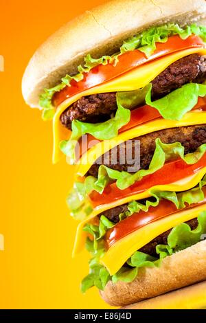 Tasty and appetizing hamburger on a yellow background Stock Photo - Alamy