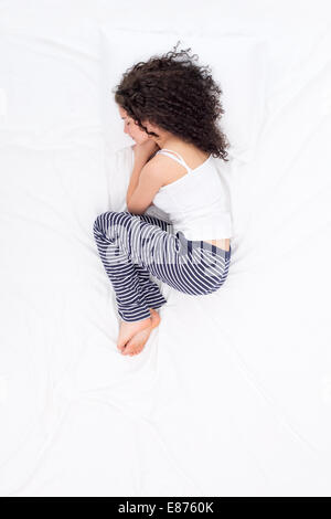 Female sleeping Foetus pose Stock Photo - Alamy