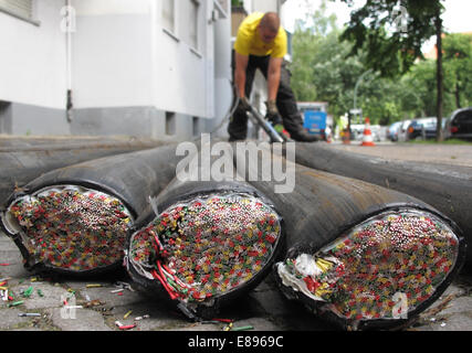 Berlin, Germany, a man cut old telephone underground cables Stock Photo ...