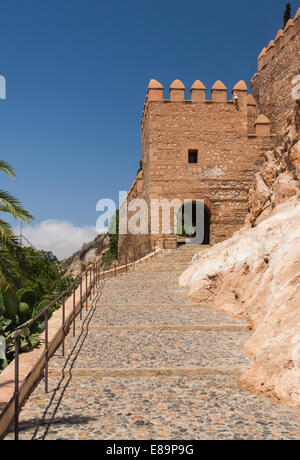 The Alcazaba in Almeria, Spain, features a gate and tower, typical of ...