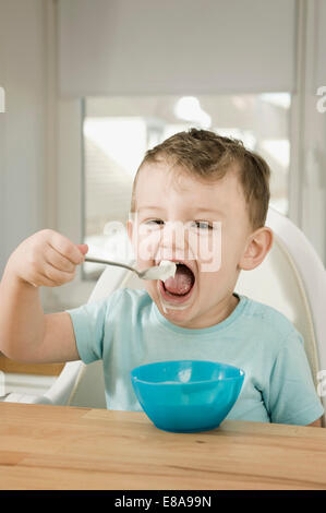 Boy eating pap Stock Photo - Alamy