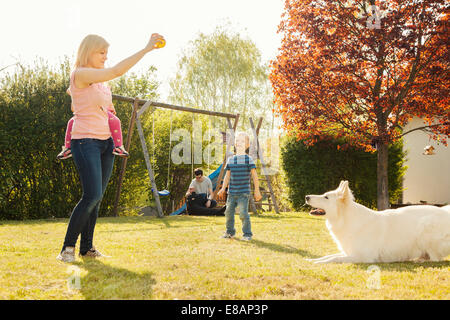 mother and son training their family dog Stock Photo - Alamy
