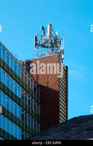 mobile telephone and telecommunications equipment mounted on top of a ...