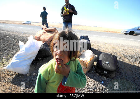 Suruc, Turkey. 5th Oct, 2014. Syrian Kurdish refugees continue to seek ...