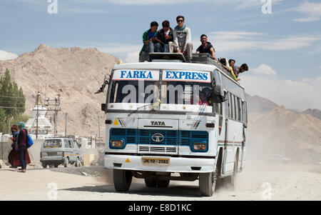 Indian bus overloaded with passengers and pilgrims returning from the ...