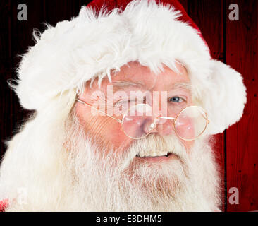 Composite image of santa claus winking Stock Photo - Alamy