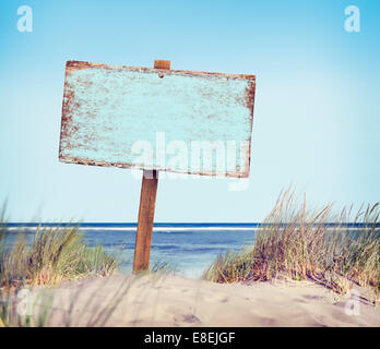 Beach with Empty Plank Sign Stock Photo - Alamy