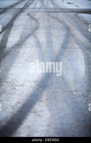 Snow-covered road, the marks of wheels Stock Photo - Alamy