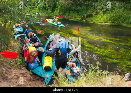A group of young kayakers. Bystrzyca river Kayaking expedition. Poland ...