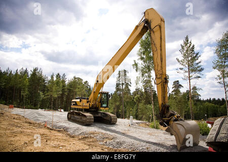 mechanical digger bulldozer excavator on building site Stock Photo - Alamy
