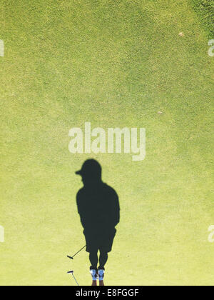 Shadow of man playing golf Stock Photo - Alamy