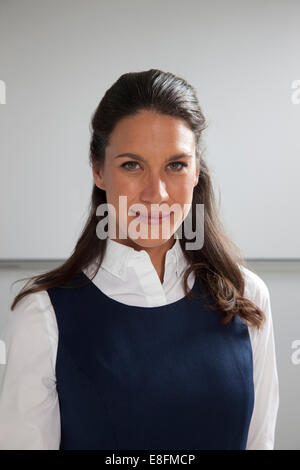 Young teacher in front of whiteboard Stock Photo - Alamy