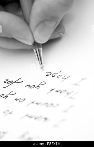 Writing letter to a friend. Hand holding a fountain pen Stock Photo - Alamy