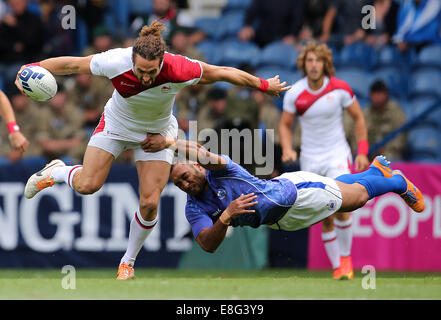 Michael Ellery (ENG) manages to avoid a tackle from Lolo Lui (SAM ...