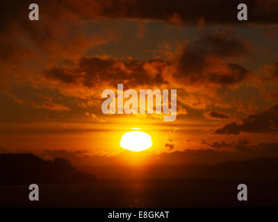 SUNSET OVER LAND Stock Photo - Alamy