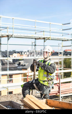 Construction worker working at the site Stock Photo - Alamy