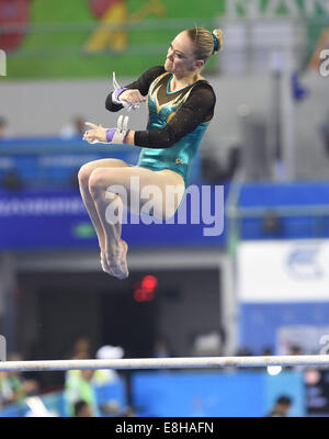 Australian gymnast Larrissa Miller performs on the uneven bars during ...