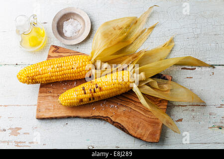 Boiled corn on a blue wood background Stock Photo - Alamy