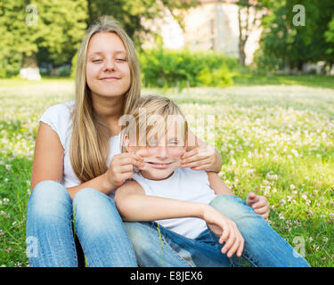 Funny teenager child girl show peace cool v-sign isolated over yellow ...