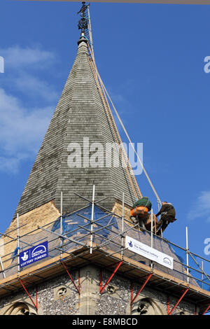 Headley, Surrey, UK. 10th October 2014. Workers repair the historic ...