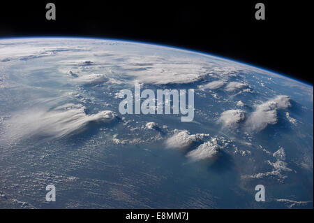 Afternoon sunlight casts long shadows from thunderhead anvils down onto ...