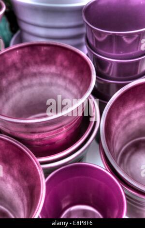 Stack of colourful pottery garden pots Stock Photo - Alamy
