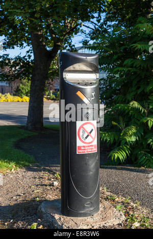 Cigarette disposal bin in smoking zone Stock Photo - Alamy