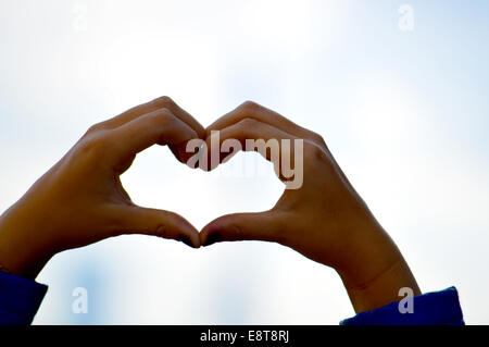 Hands creating a heart Stock Photo - Alamy