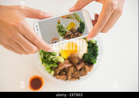 man with phone photographing food at restaurant Stock Photo - Alamy