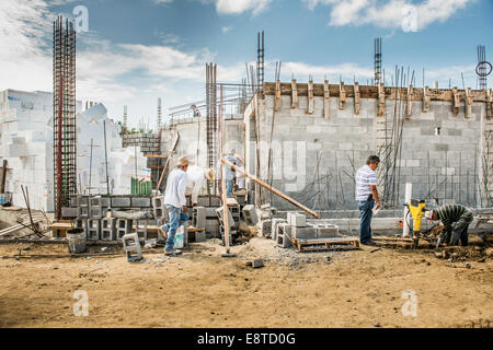 Hispanic 40 s worker builder on site construction. American middle aged ...