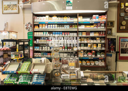Inside displays of a tobacconist shop that sells cigarettes, lose ...