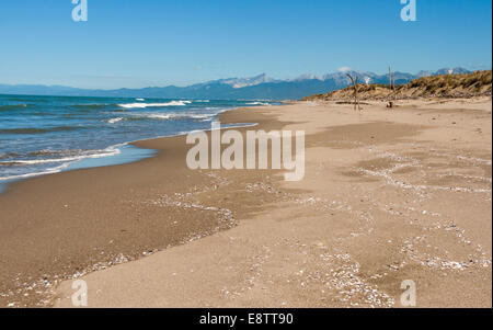 Tuscany deserted sand beach and mountains landscape, Italy Stock Photo ...