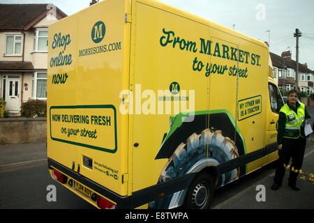 A Morrisons Supermarket delivery driver and his van out on a round in ...