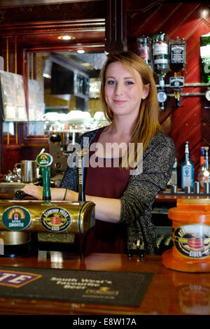 barmaid pouring a pint in a traditional british pub the eldon arms ...