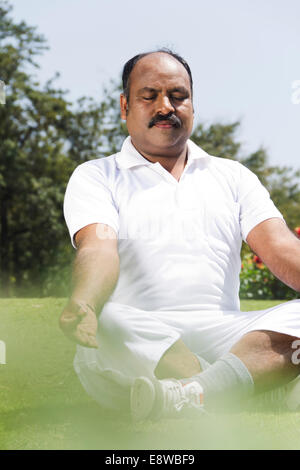 1 Indian Man Exercising in Parks with kid Stock Photo - Alamy