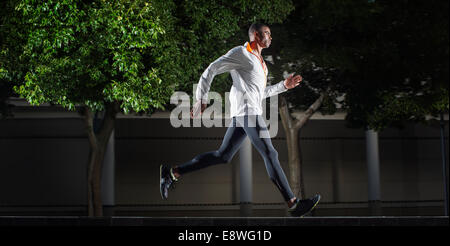 Man running through city streets Stock Photo - Alamy