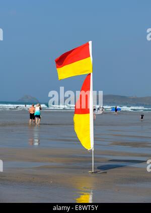 Lifeguard on duty warning flags yellow and red on newquay beaches Stock ...