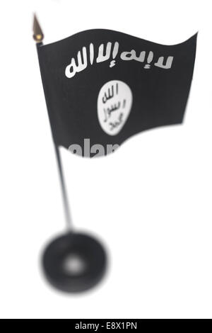 Small flag of ISIL, ISIS in a stand isolated on a white background ...