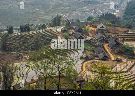 Couple of Hmong farms on hill surrounded by submerged rice paddies in ...
