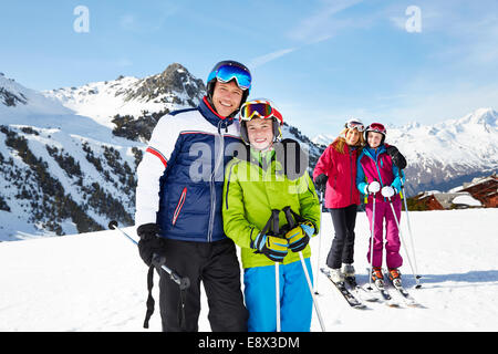 Father and son, dad and child, skiing together in Austrian resort ...