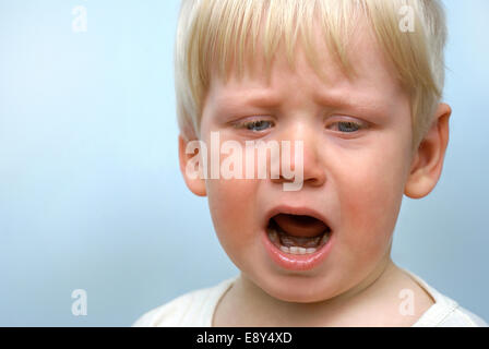 One tearful little boy crying mother consoling child Stock Photo - Alamy